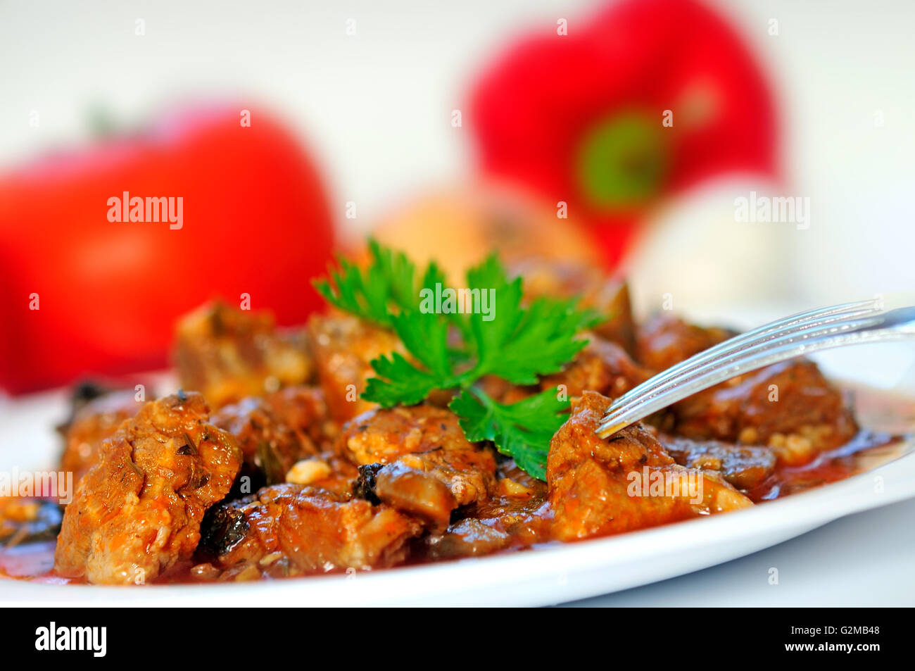 Plate with stew of pork meat Stock Photo - Alamy