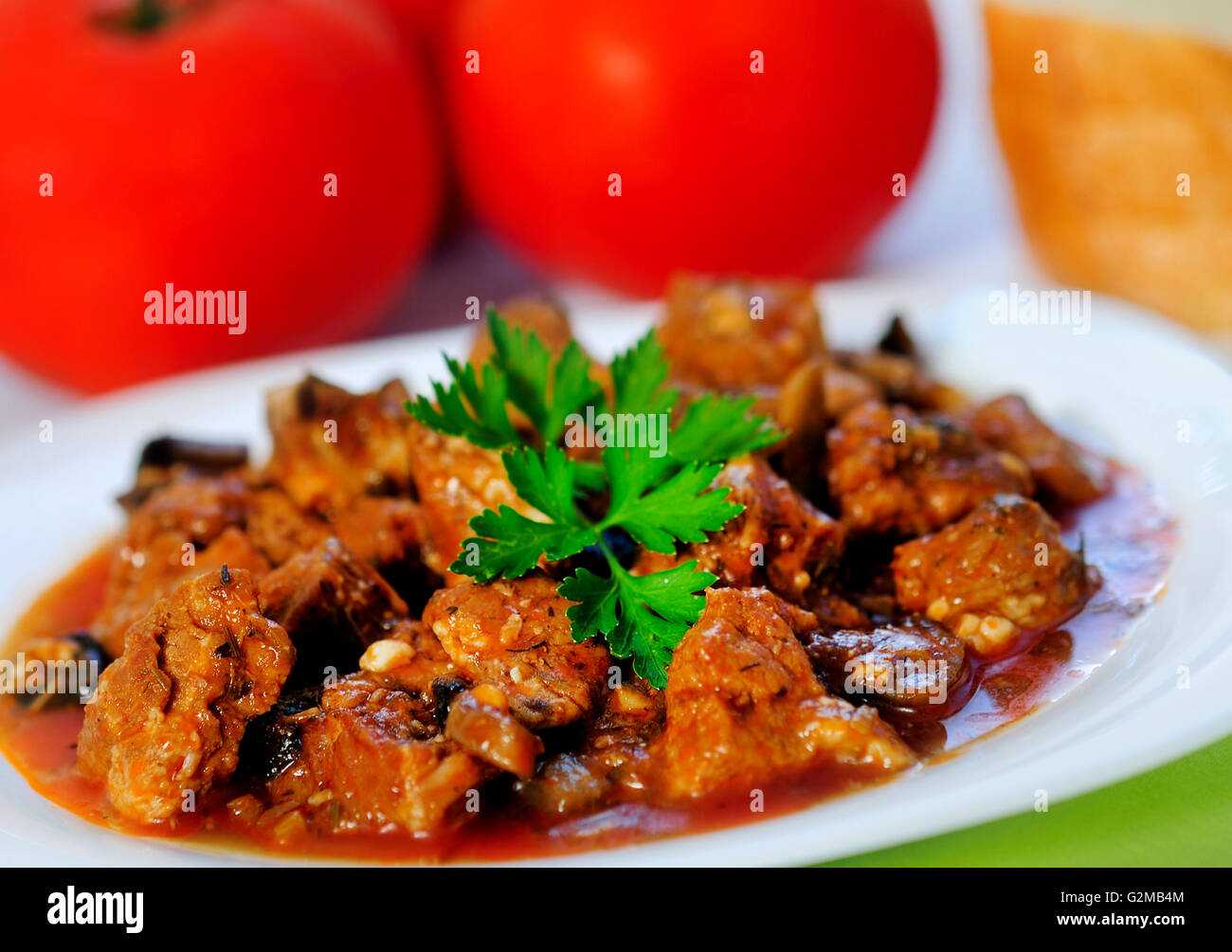 Plate with stew of pork meat Stock Photo - Alamy