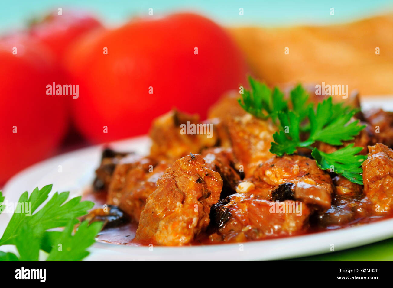 Plate with stew of pork meat Stock Photo - Alamy