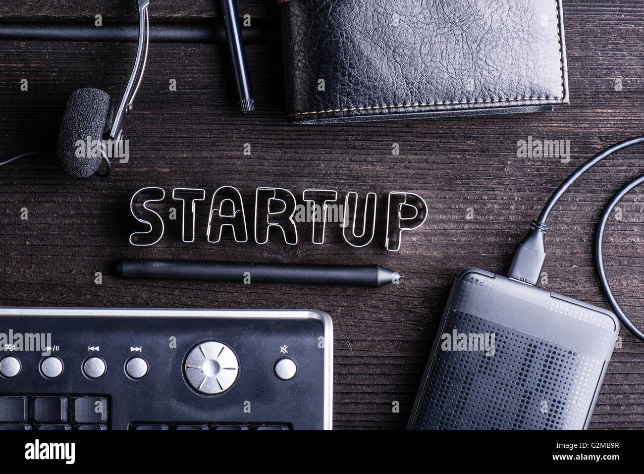 Start up composition. Various office things around workspace and sign ...