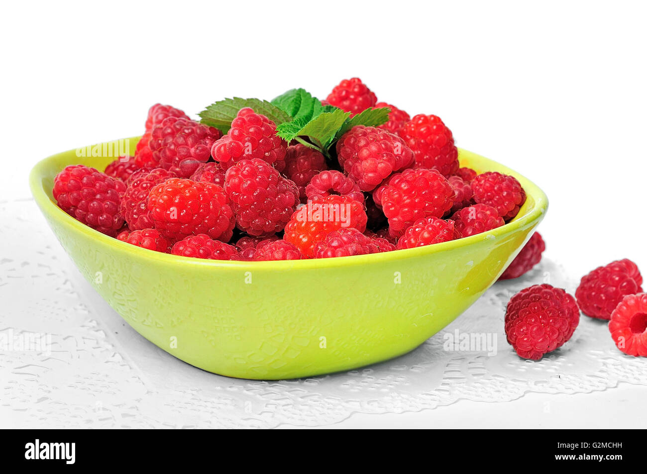 Bowl with raspberry on table Stock Photo - Alamy