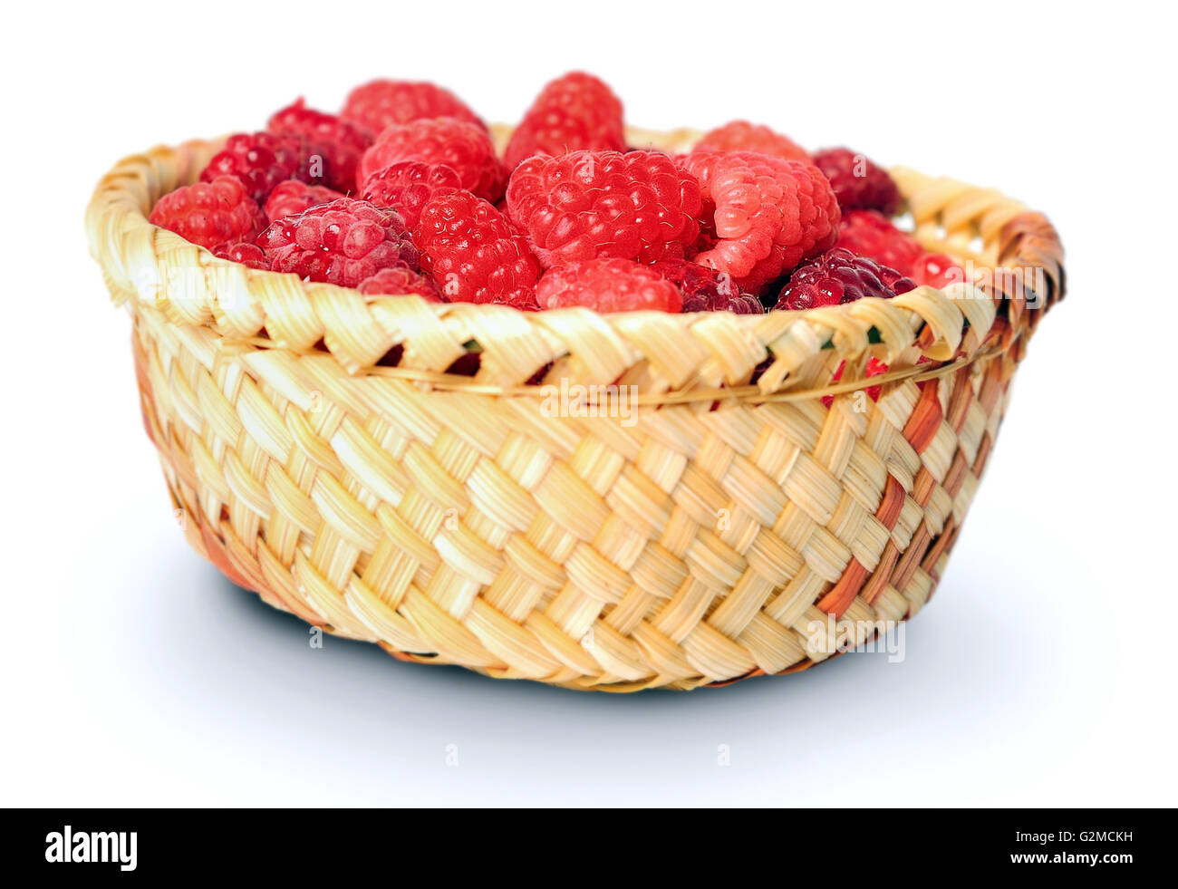 Isolated basket with raspberry on white Stock Photo - Alamy