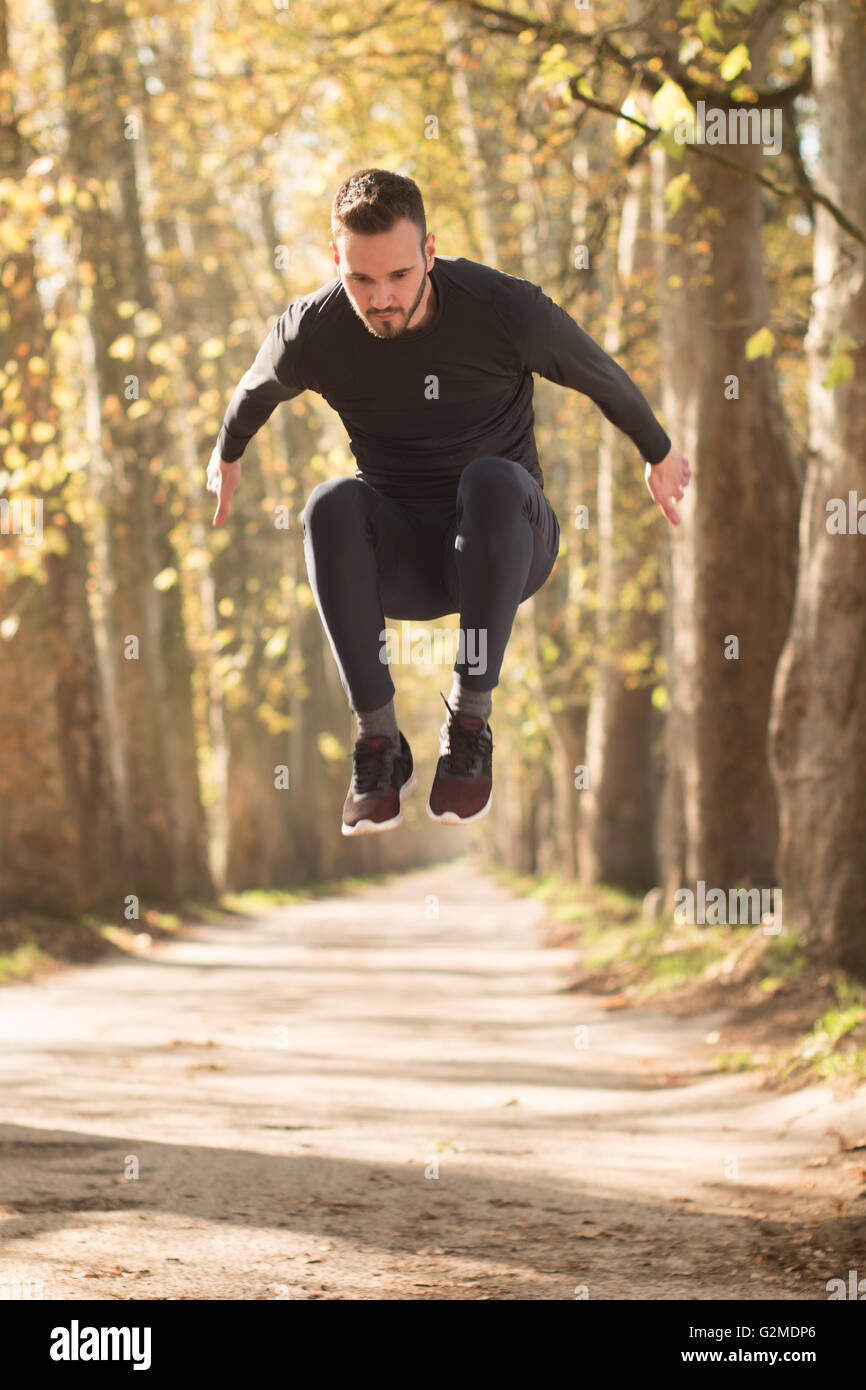 Sport running man in cross country trail run. Fit male runner exercise ...