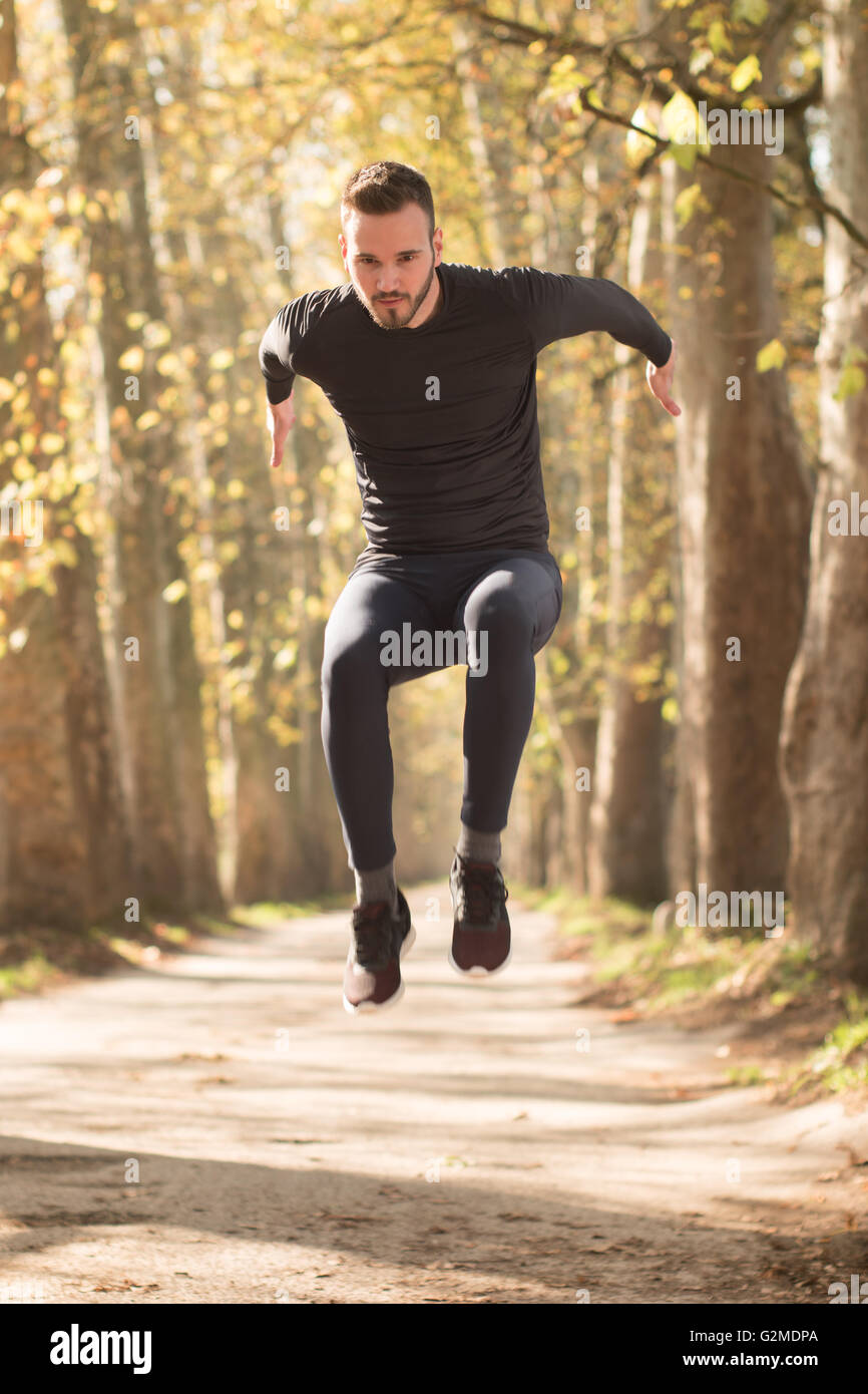 Sport running man in cross country trail run. Fit male runner exercise ...