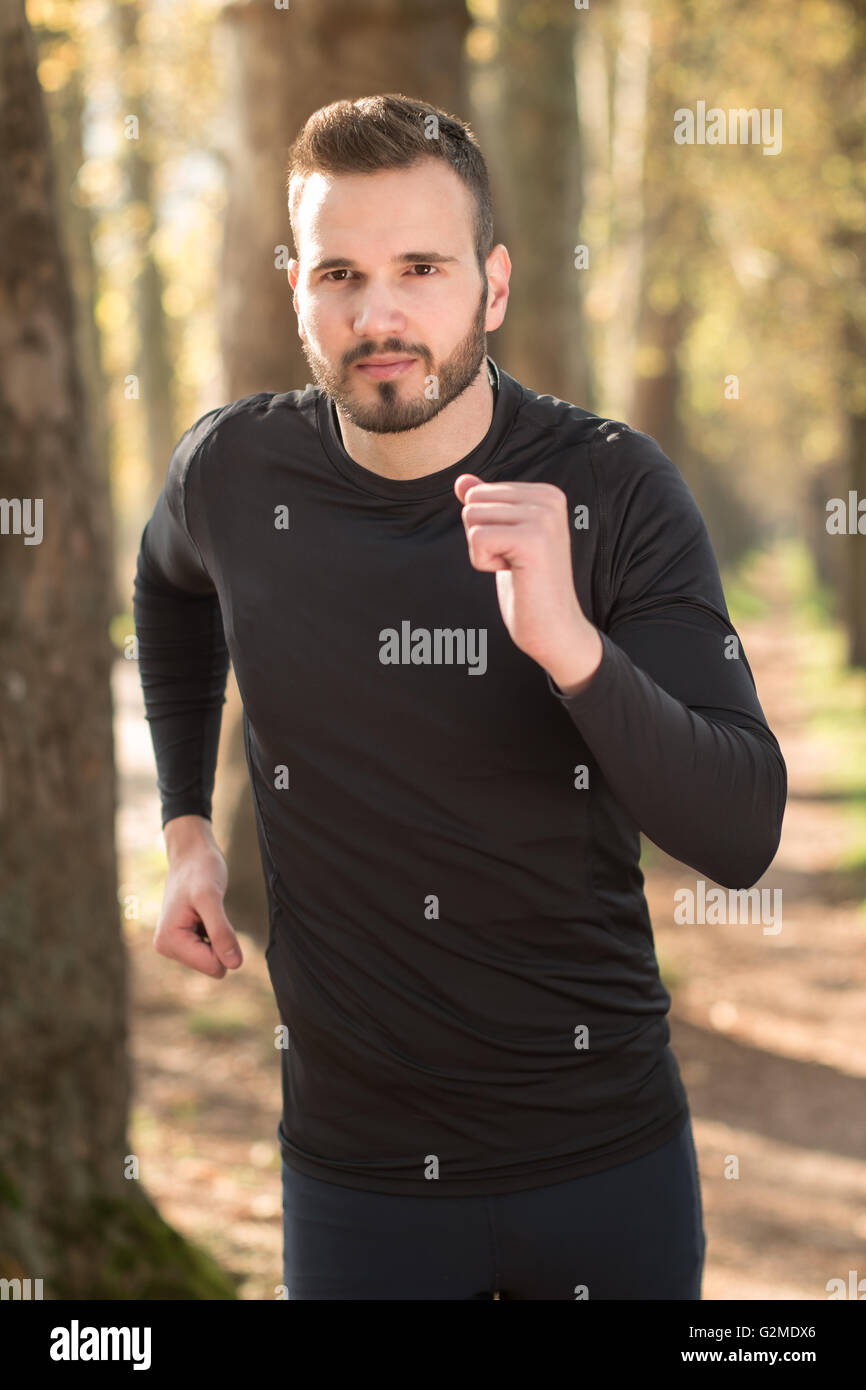 Photo of handsome nice guy outdoors at morning. Young man looking at ...