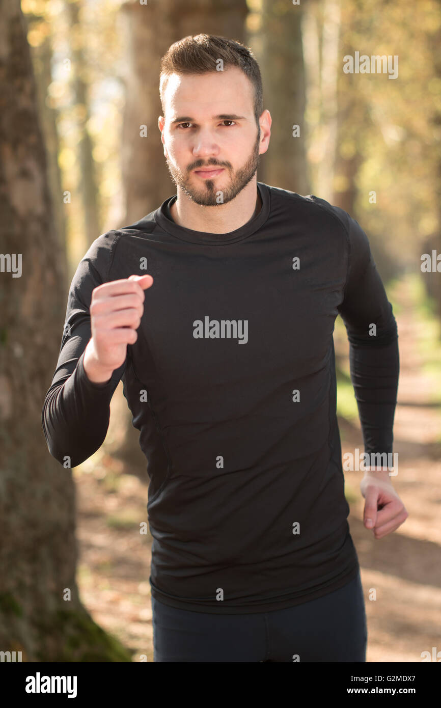 Photo of handsome nice guy outdoors at morning. Young man looking at ...