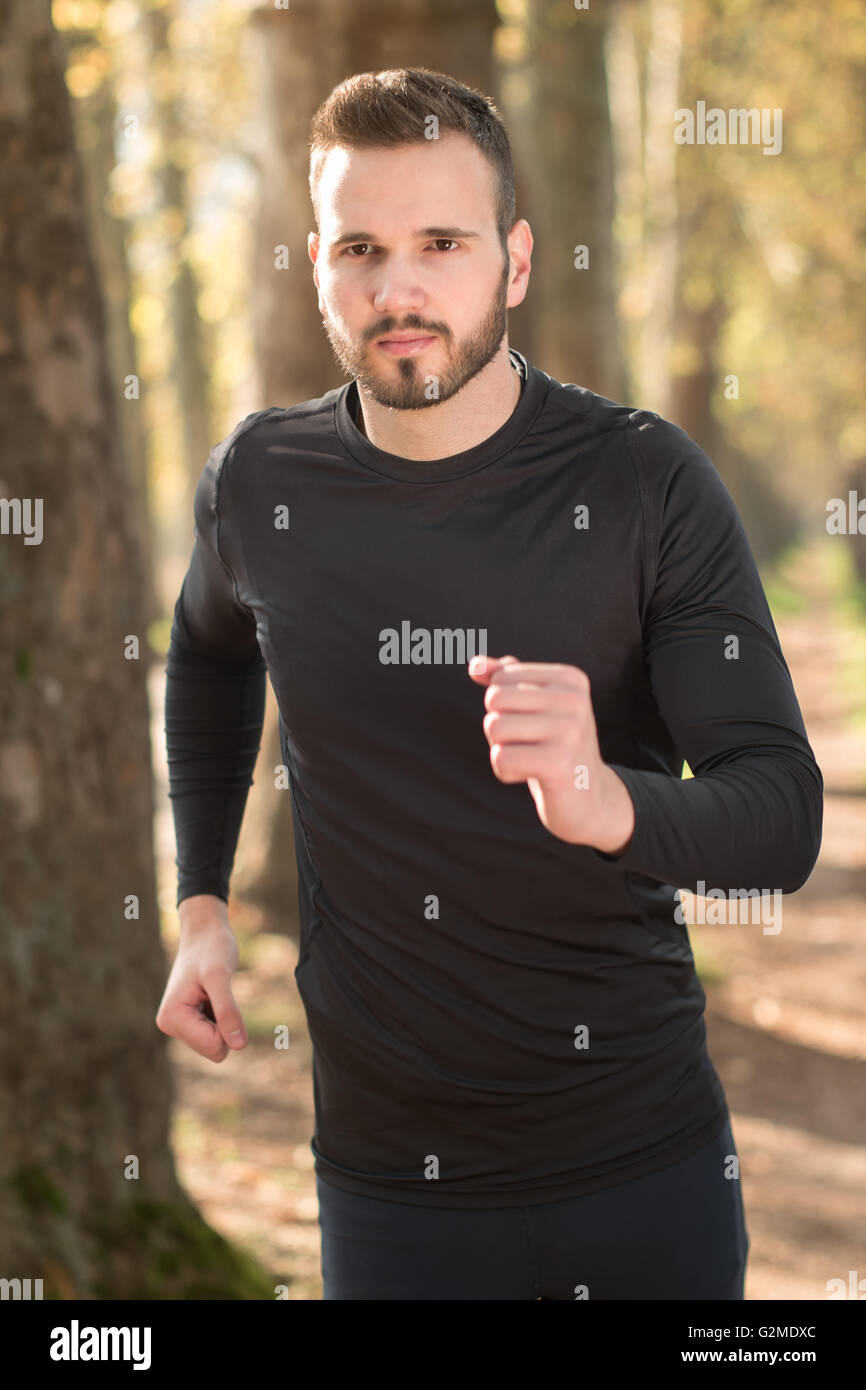 Photo of handsome nice guy outdoors at morning. Young man looking at ...