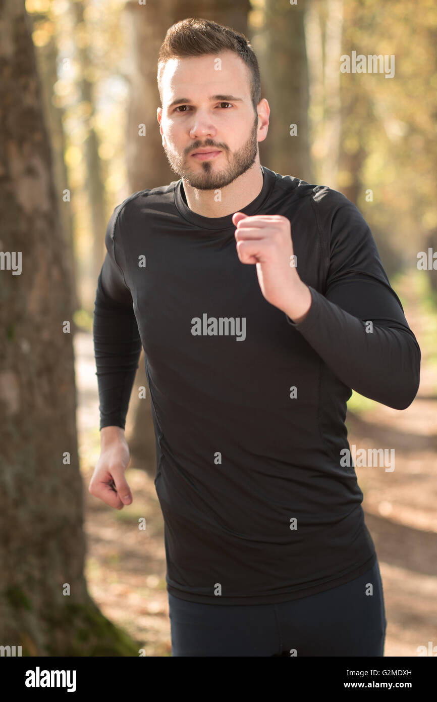 Photo of handsome nice guy outdoors at morning. Young man looking at ...