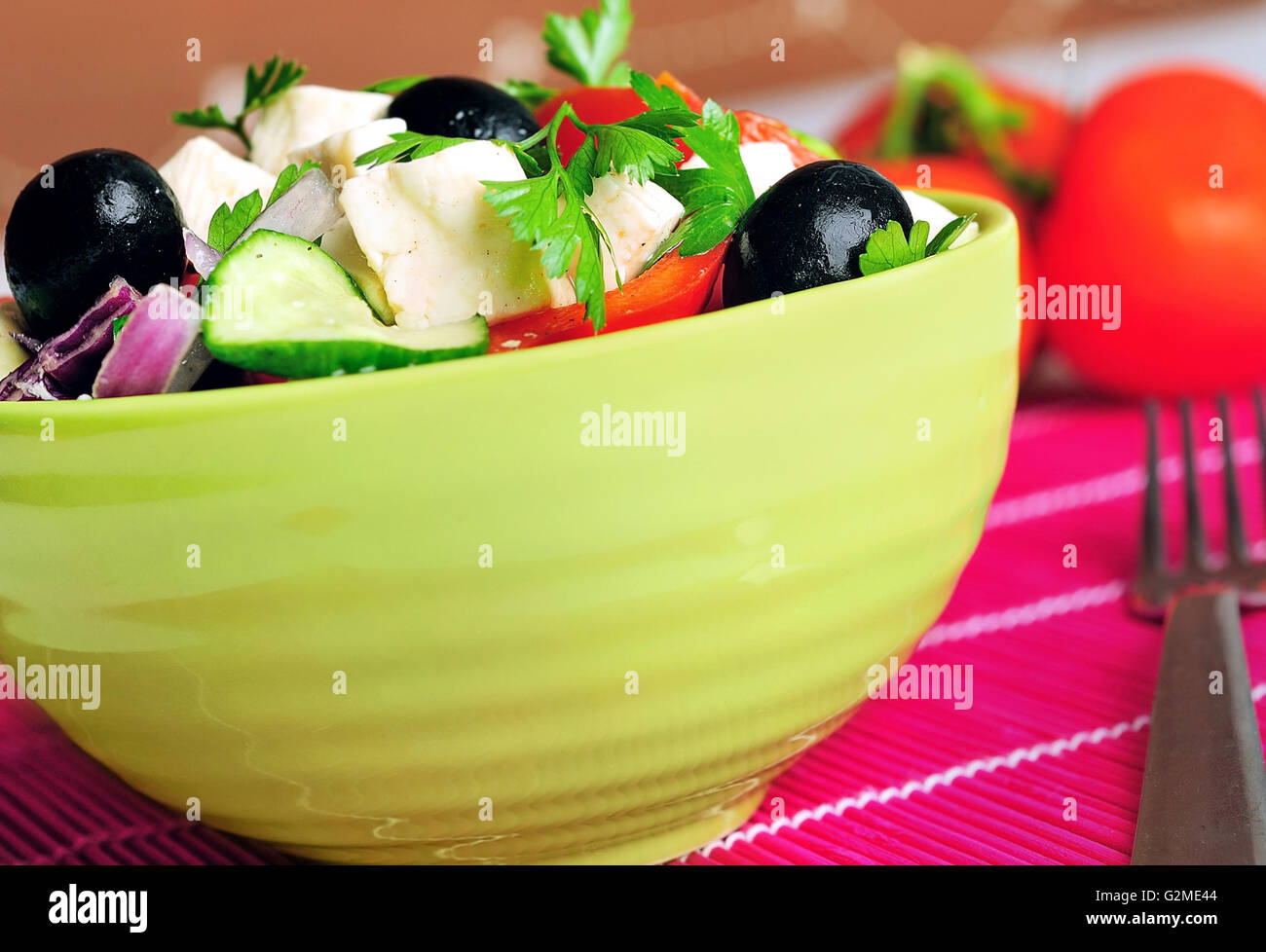 Bowl with vegetable salad on table Stock Photo - Alamy