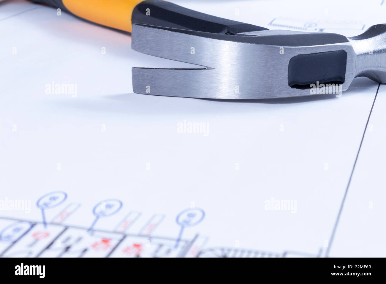 Close up shot of a claw hammer head laying on a technical drawing Stock ...