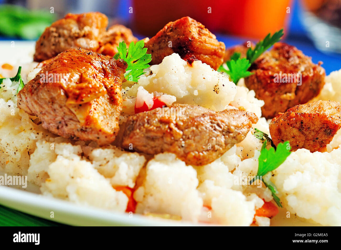 Plate with risotto and meat Stock Photo - Alamy