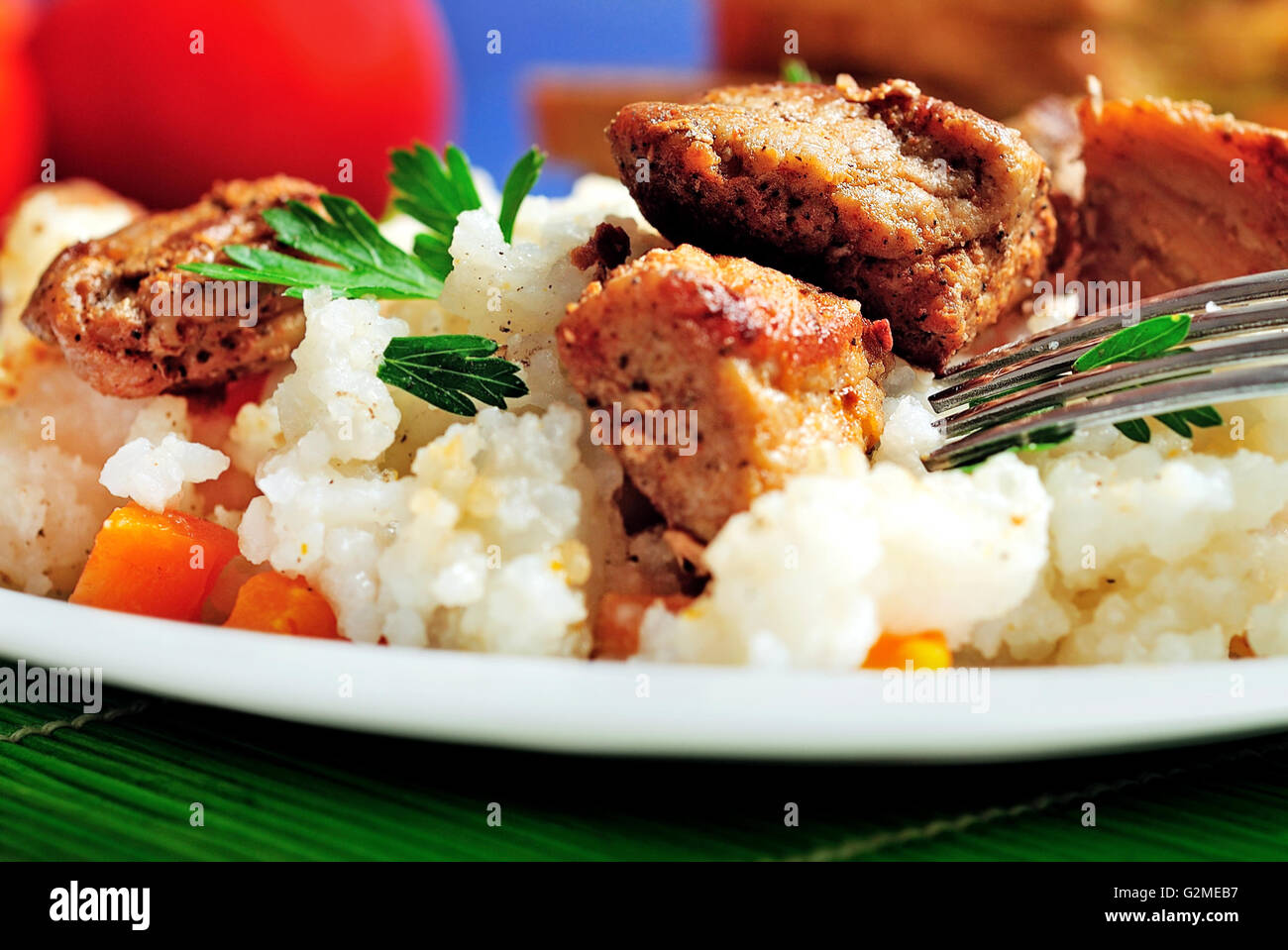 Plate with risotto and meat Stock Photo - Alamy