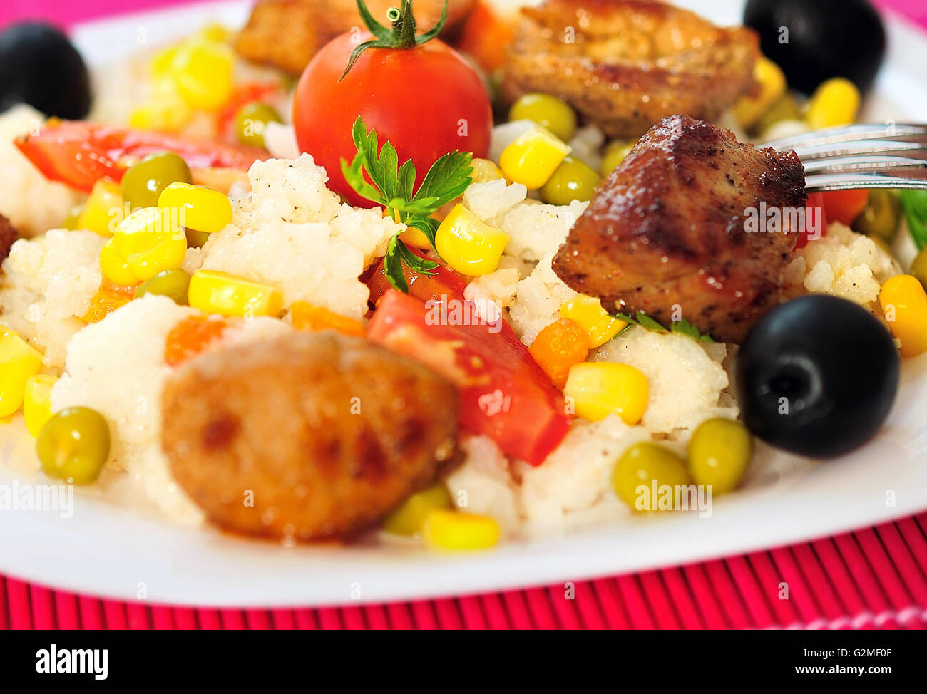 Plate with risotto and meat Stock Photo - Alamy