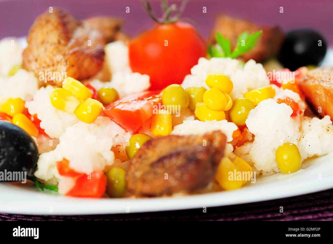 Plate with risotto and meat Stock Photo - Alamy