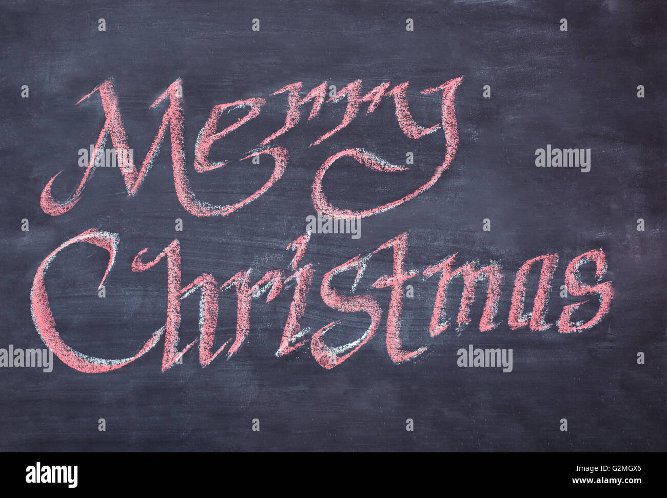 Merry Xmas greeting handwritten on a small slate chalkboard Stock Photo ...