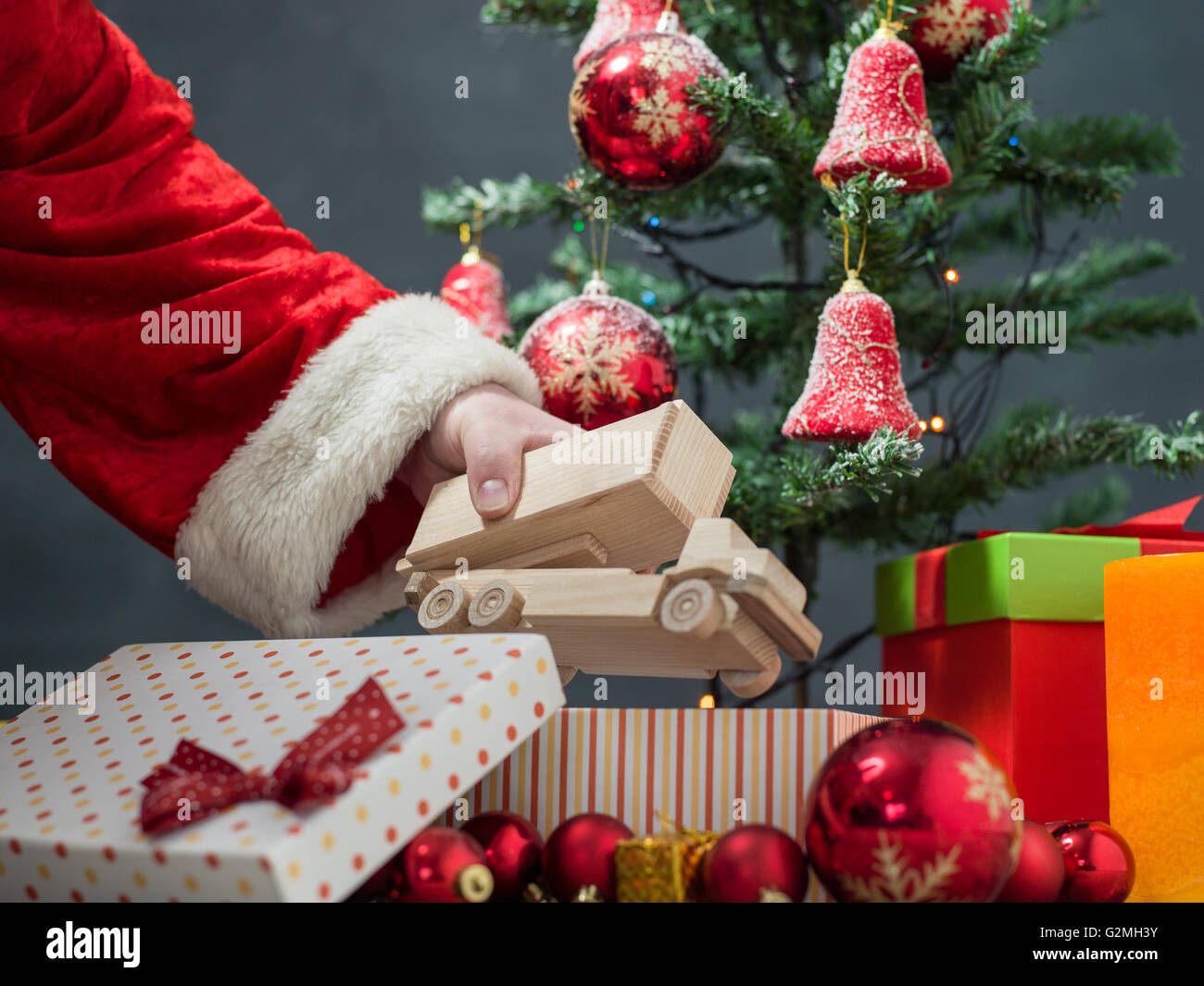 Putting gifts under fir tree hi-res stock photography and images - Alamy
