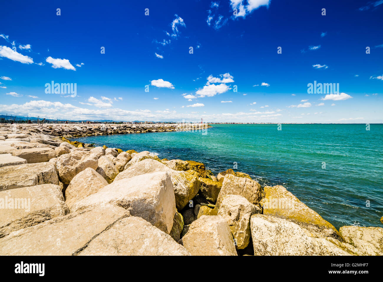 Panorama of the Adriatic Riviera in Romagna, Italy, with red lighthouse ...