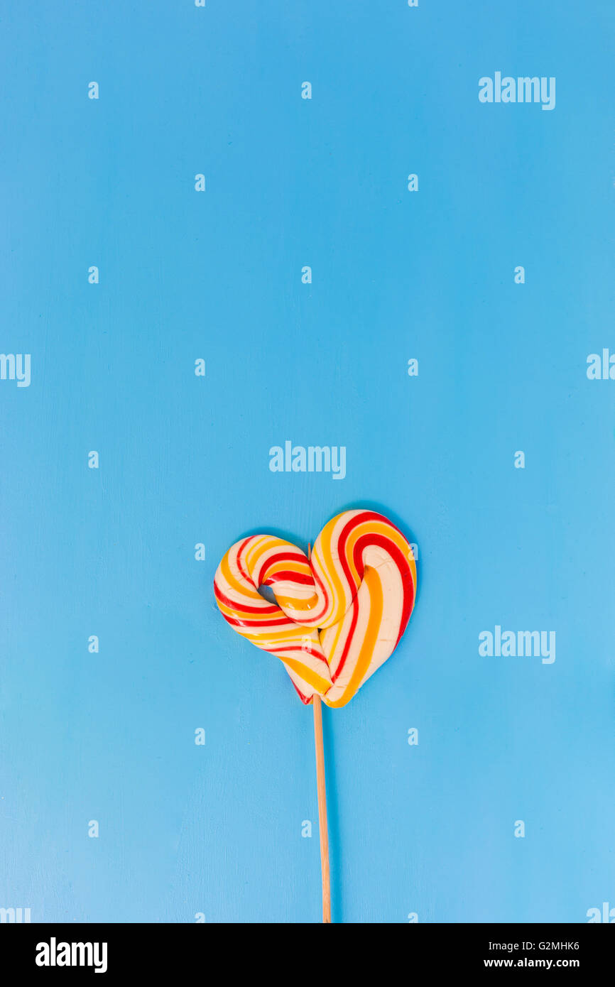 candy heart on a color background Stock Photo - Alamy
