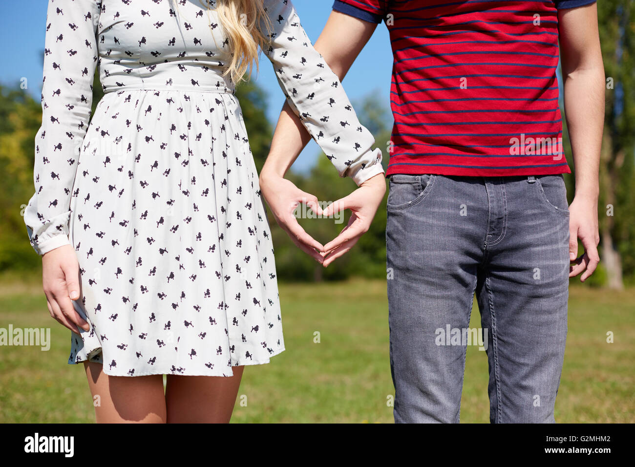 Valentines couple make heart shape with hands Stock Photo - Alamy