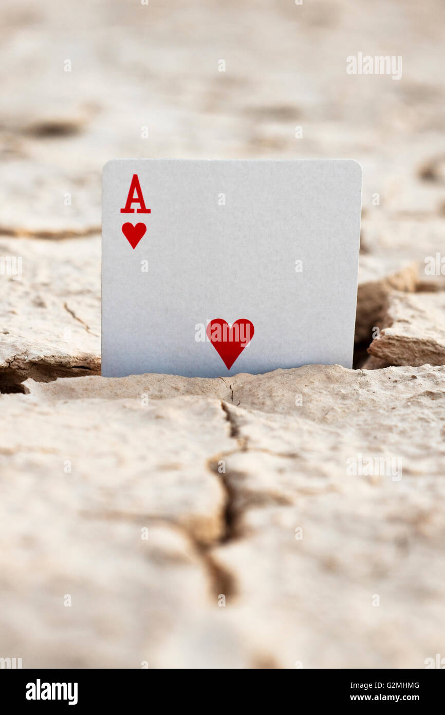 red ace playing card in a cracked desert grounds Stock Photo - Alamy