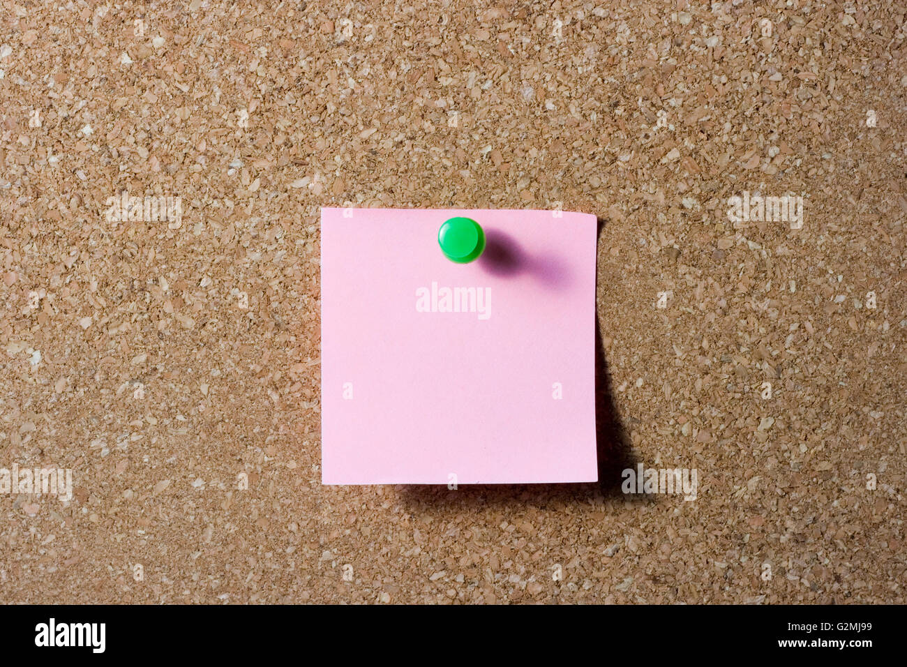pink note with green push pin Stock Photo - Alamy