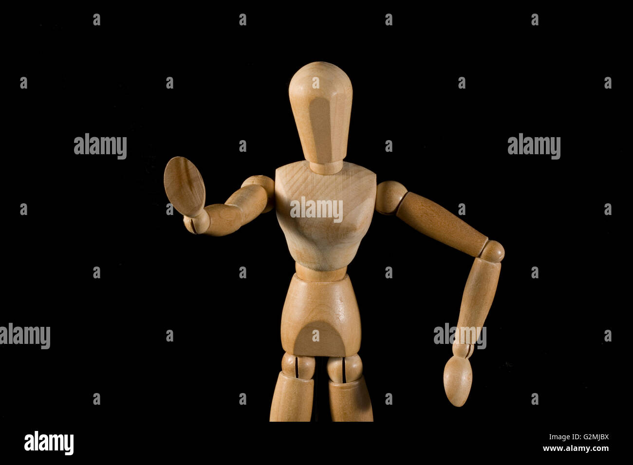 wood puppet stop sign on black background Stock Photo - Alamy