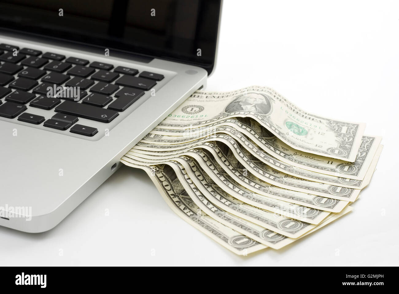 Money coming from computer hi-res stock photography and images - Alamy