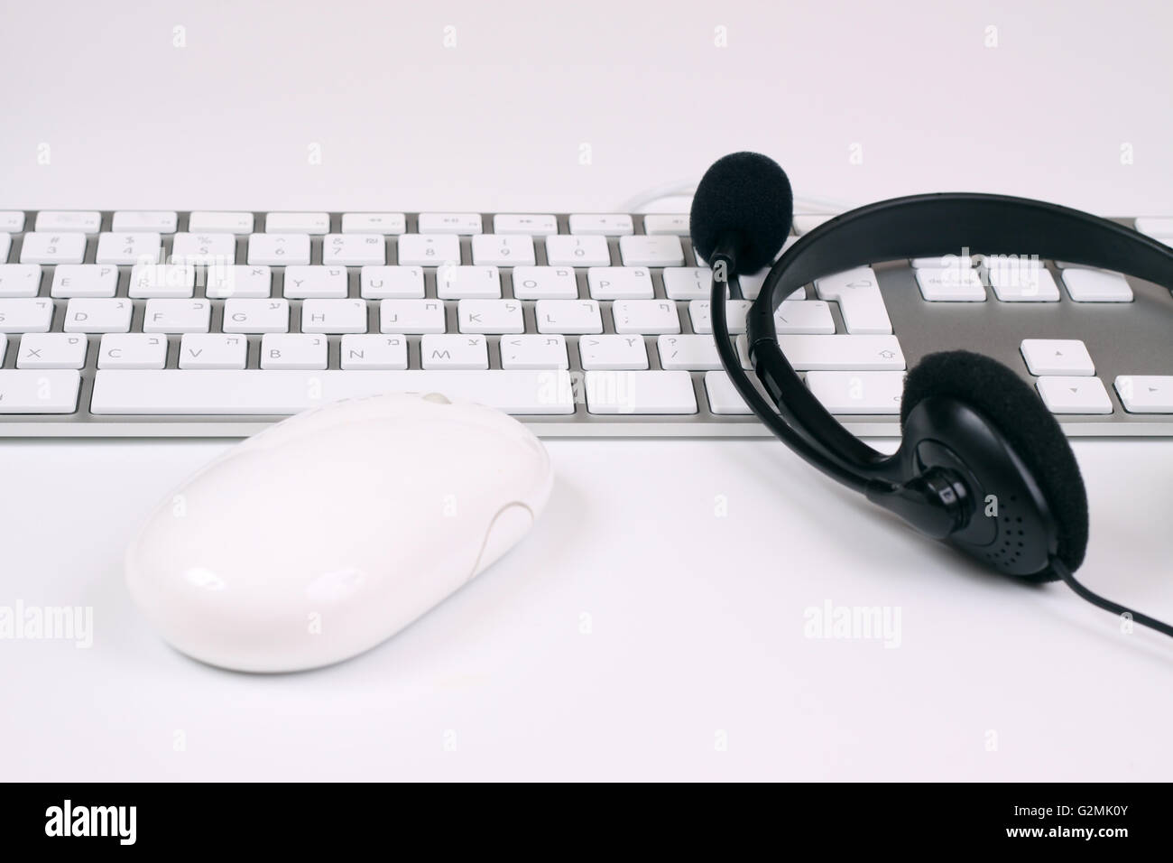 slim silver keyboard with mouse and headset on white background Stock ...