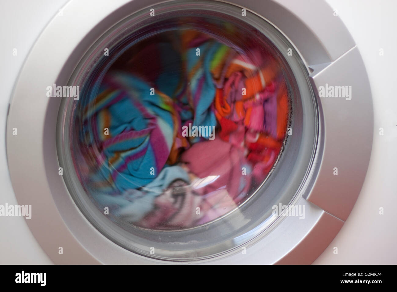 color laundry spin in a washmachine Stock Photo - Alamy