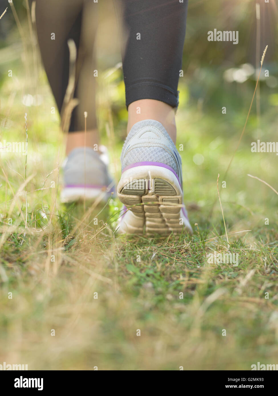 Runner feet running closeup on shoe Stock Photo - Alamy