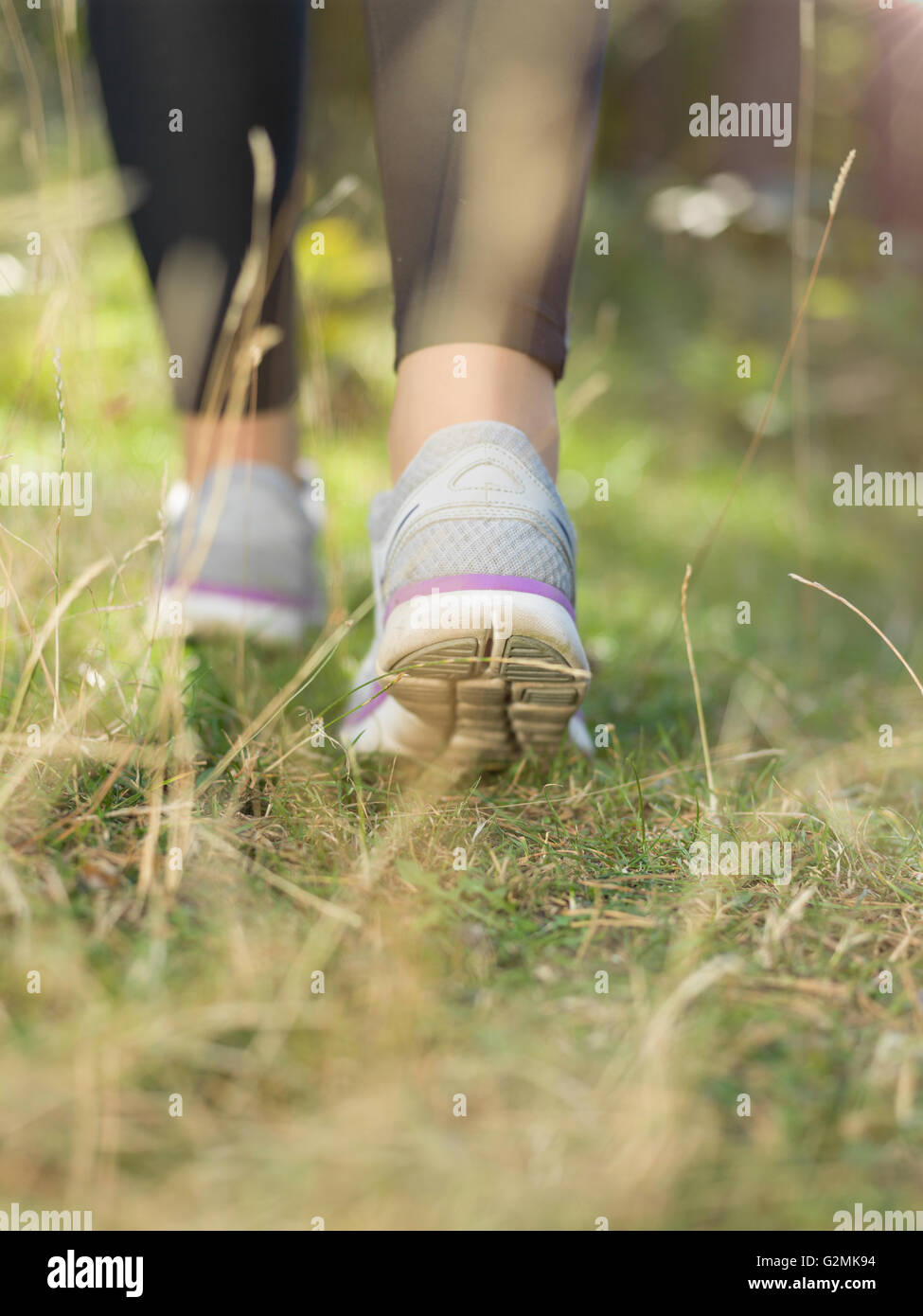 Runner feet running closeup on shoe Stock Photo - Alamy