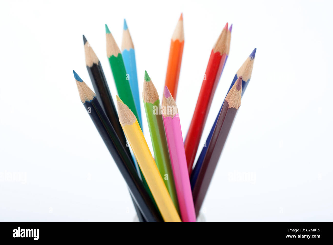 colored pencils standing upwords on white background Stock Photo - Alamy