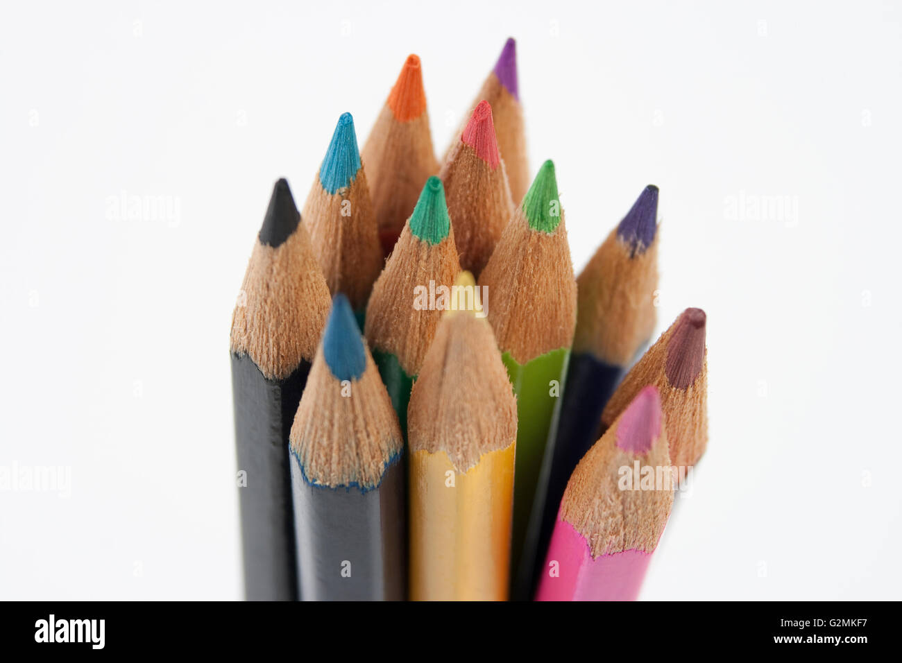 colored pencils standing upwords on white background Stock Photo - Alamy