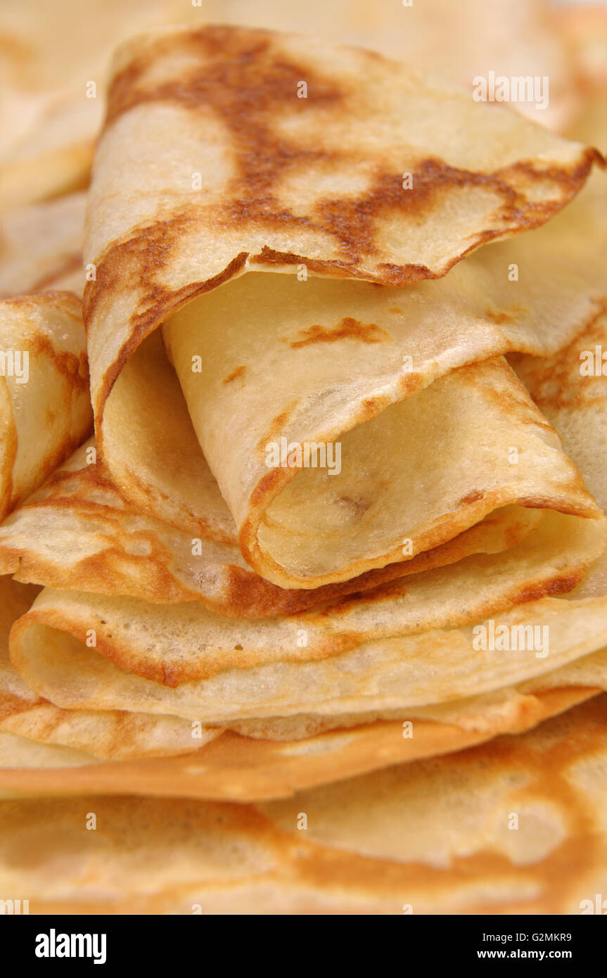 stack of folded crispy fried thin pancake closeup Stock Photo - Alamy