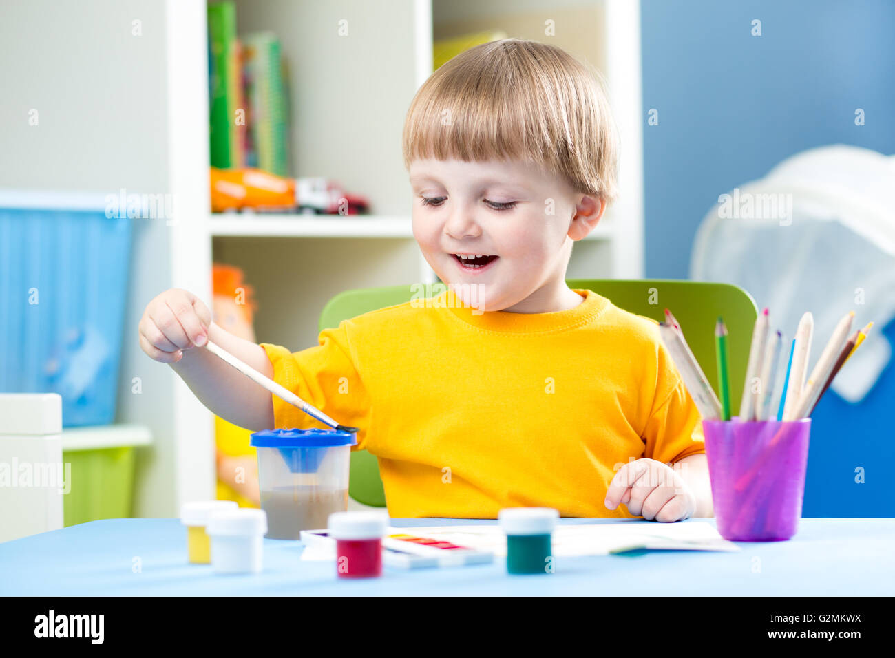 One boy painting hi-res stock photography and images - Alamy