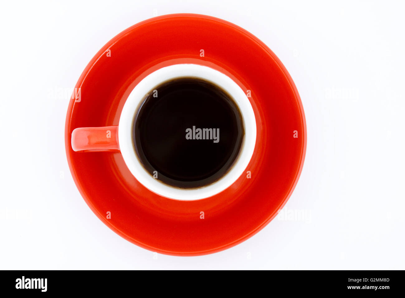 red coffe mug and plate upper view with black coffee on white ...