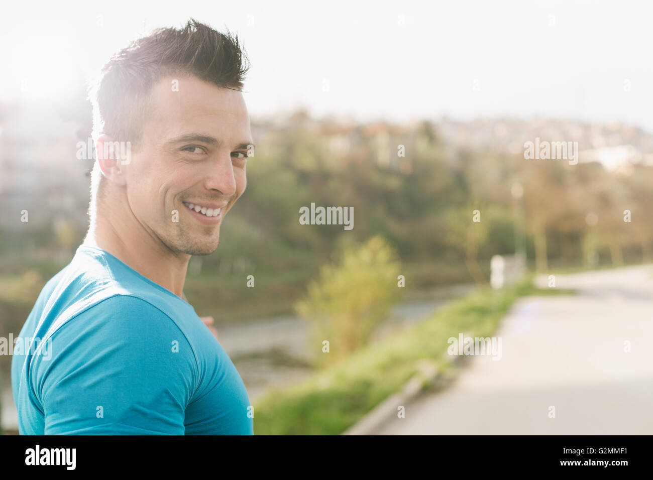 Focused handsome athlete resting after long run Stock Photo - Alamy