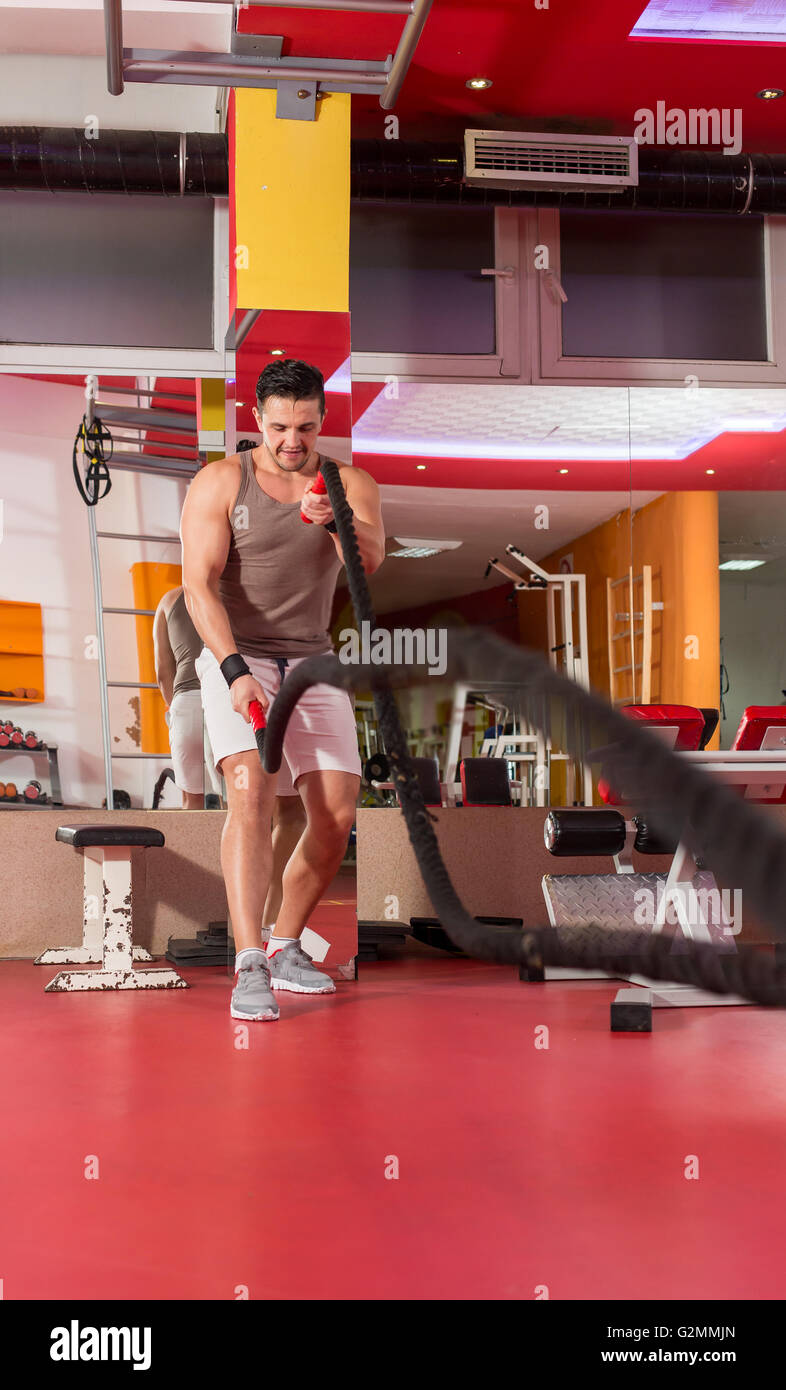 Young man bodybuilder battling ropes hi-res stock photography and ...