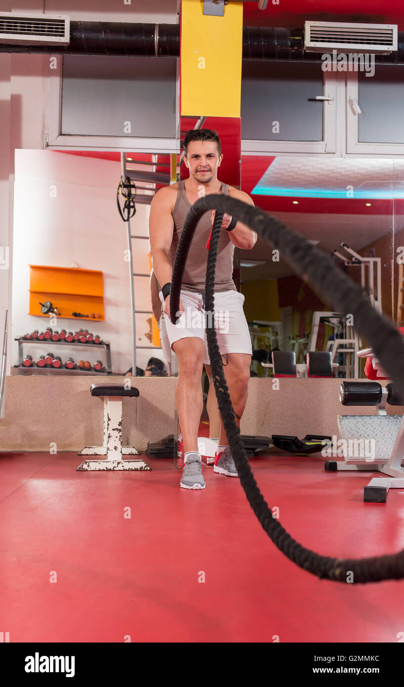 Young man bodybuilder battling ropes hi-res stock photography and ...