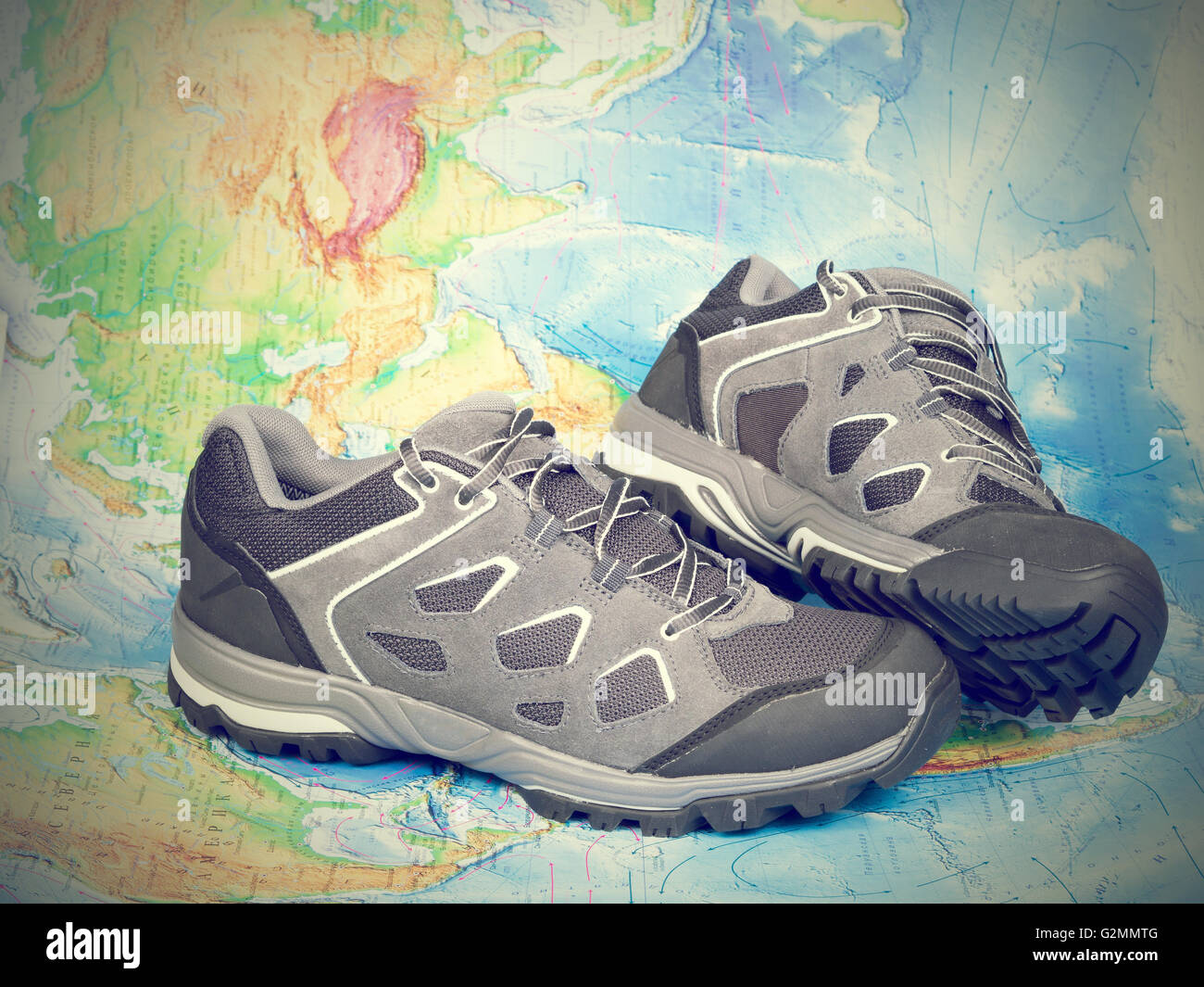 Walking trekking shoes on the world map.Travel and tourism Stock Photo ...