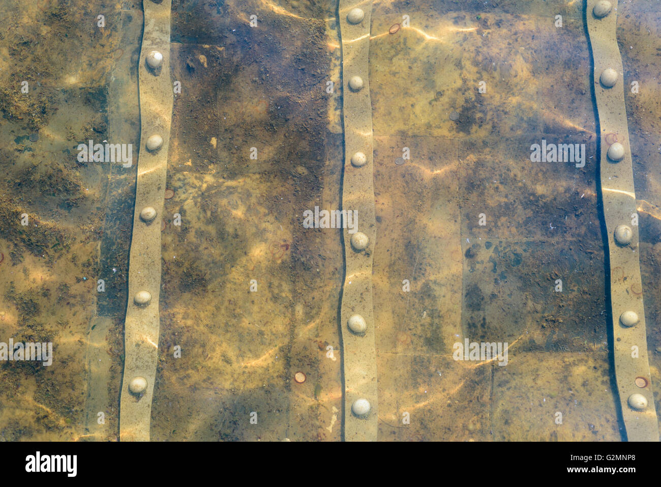 Stained metal underwater with a water wave pattern from natural ...