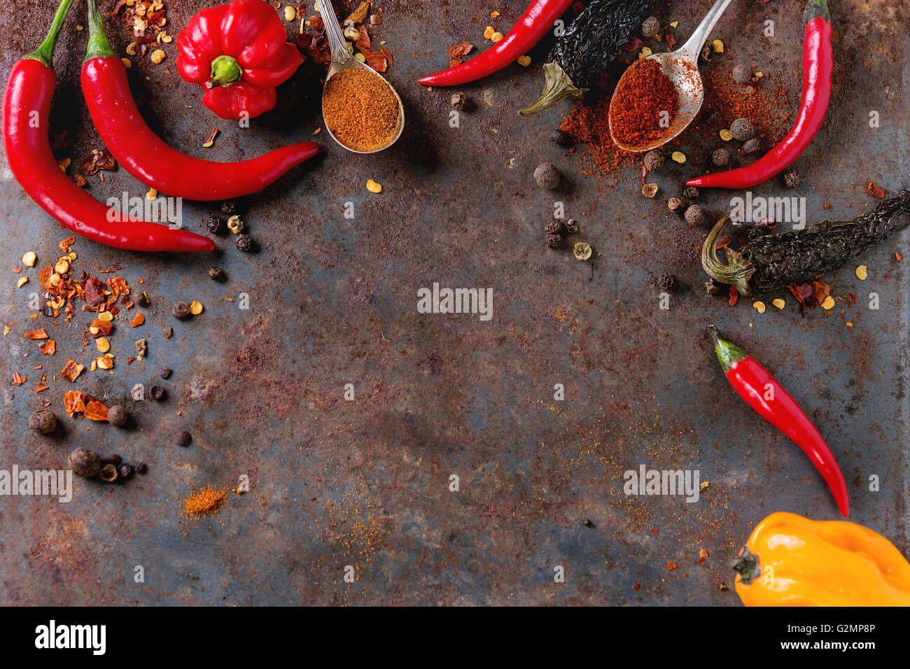 Spicy background with chili peppers Stock Photo - Alamy