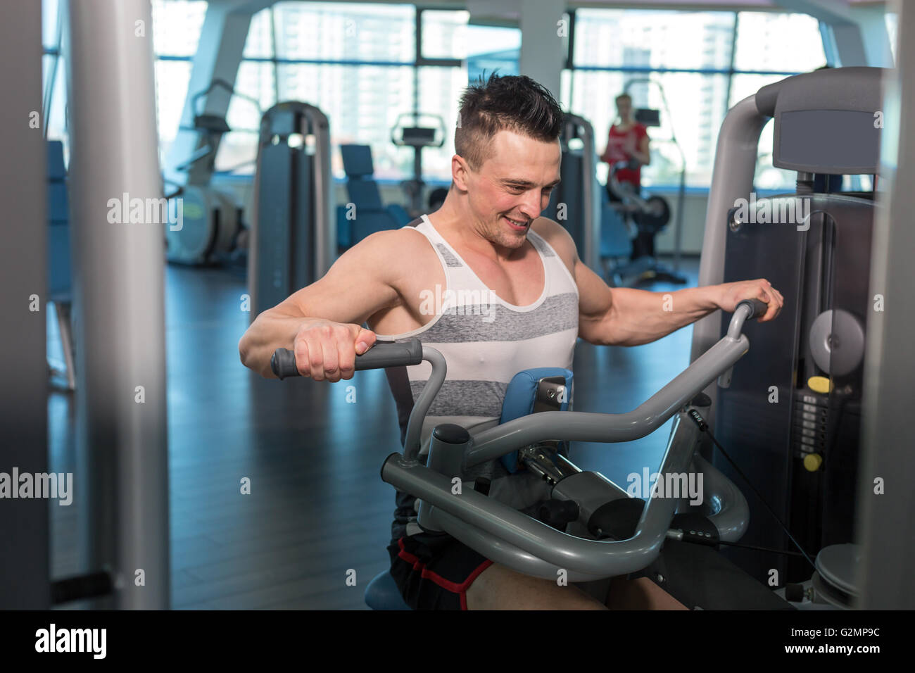 Man using chest exercise machine hi-res stock photography and images ...