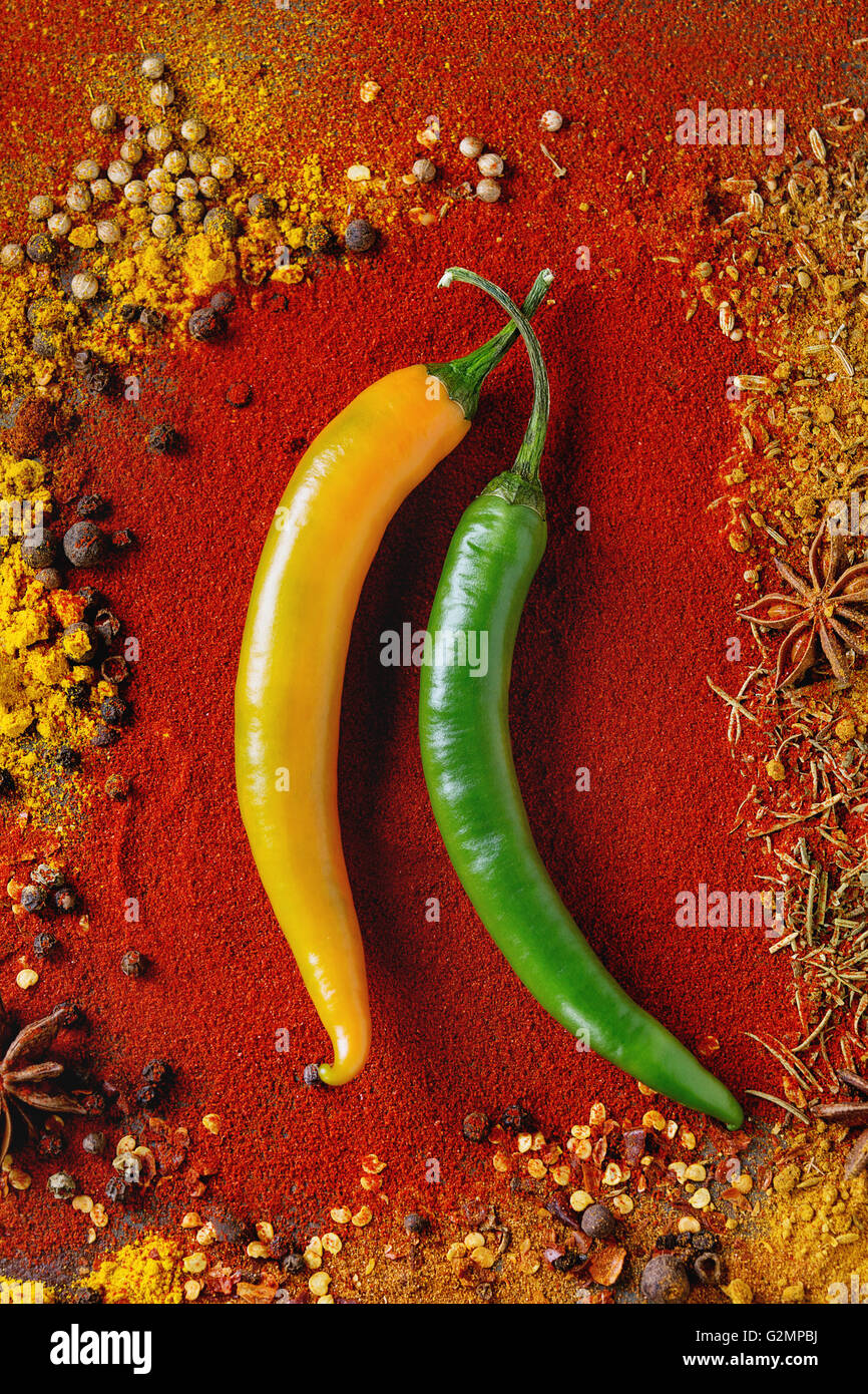 Spicy background with chili peppers Stock Photo - Alamy