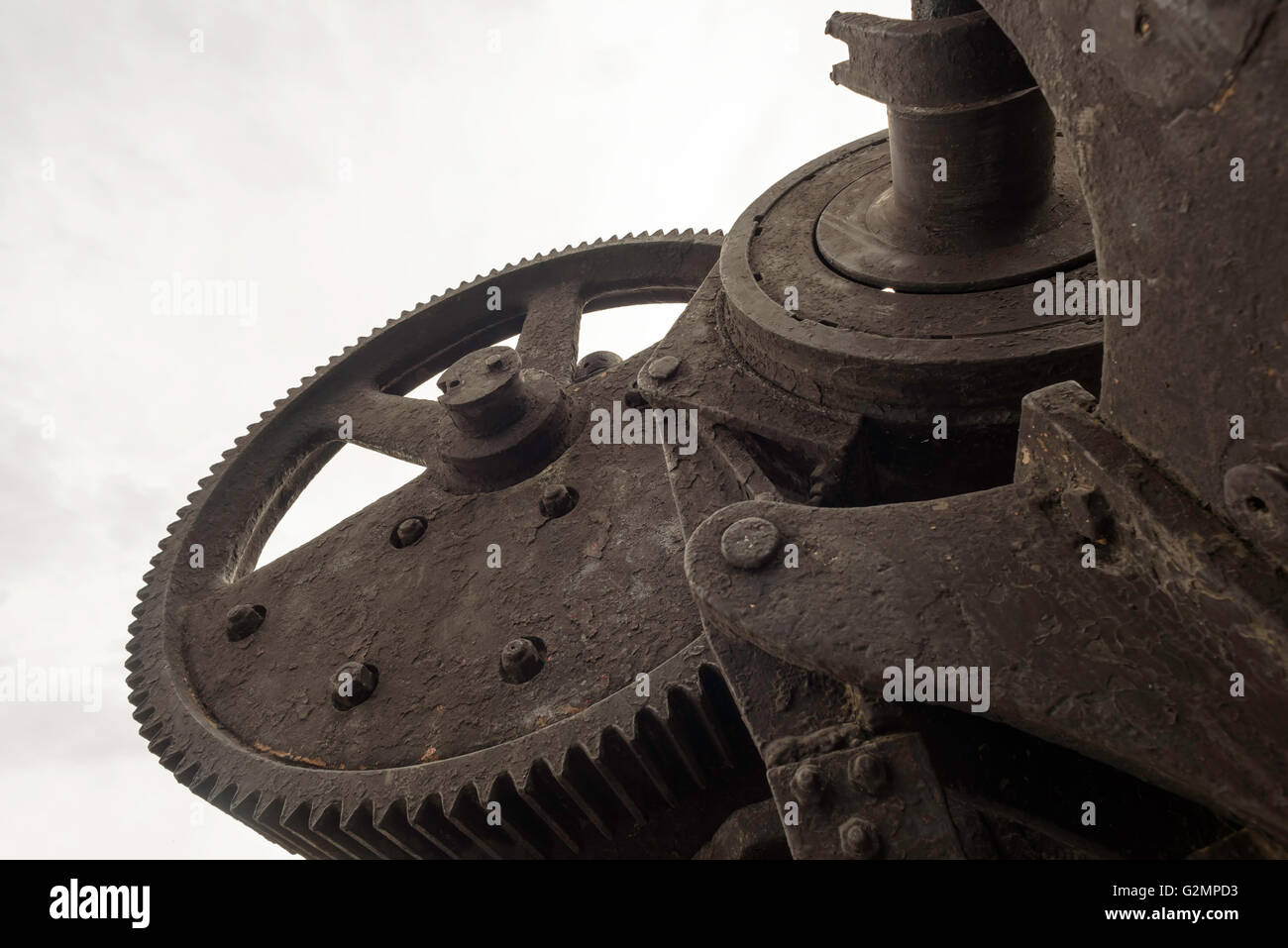 Single black painted cog wheel from an bygone industrial era set ...