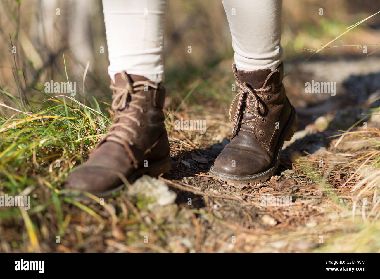 feet in shoes on a forest path Stock Photo - Alamy