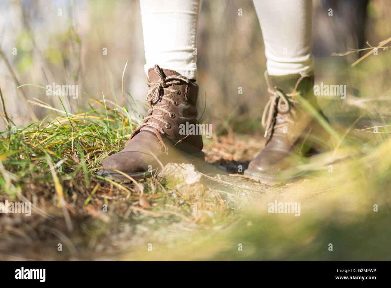 feet in shoes on a forest path Stock Photo - Alamy