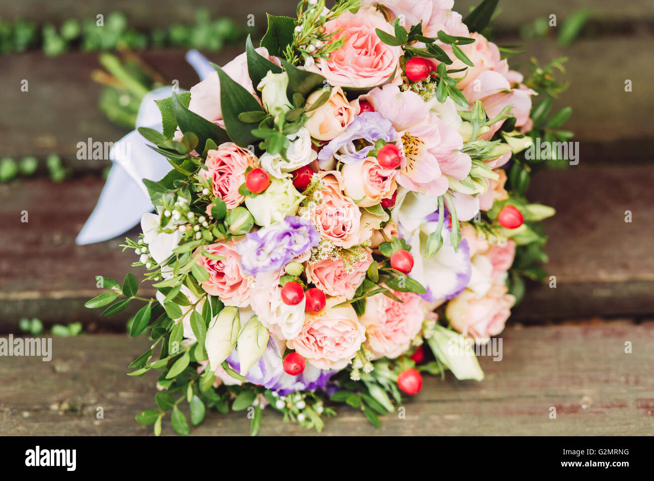 Pink, white and purple roses bride bouquet Stock Photo - Alamy