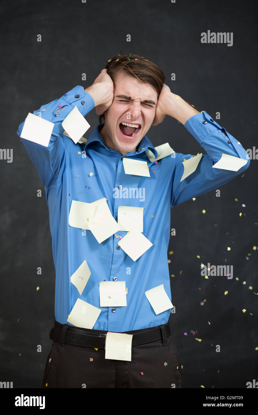 Frustrated Angry Businessman with falling confetti Stock Photo - Alamy