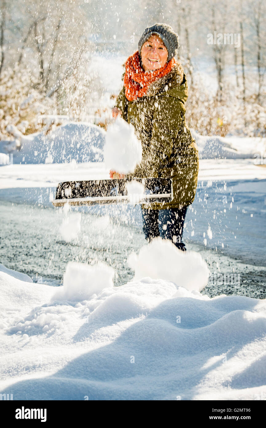 Woman shoveling snow shovel hi-res stock photography and images - Alamy